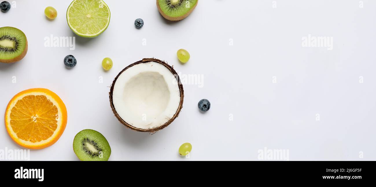 Sweet tropical fruits on light background with space for text Stock ...