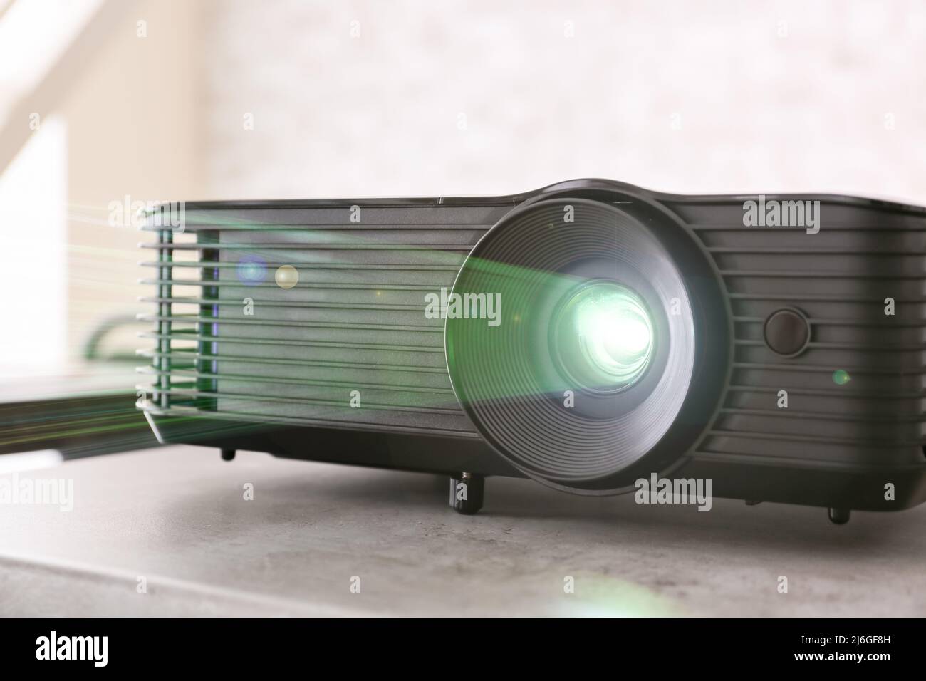 Modern video projector on table, closeup Stock Photo - Alamy