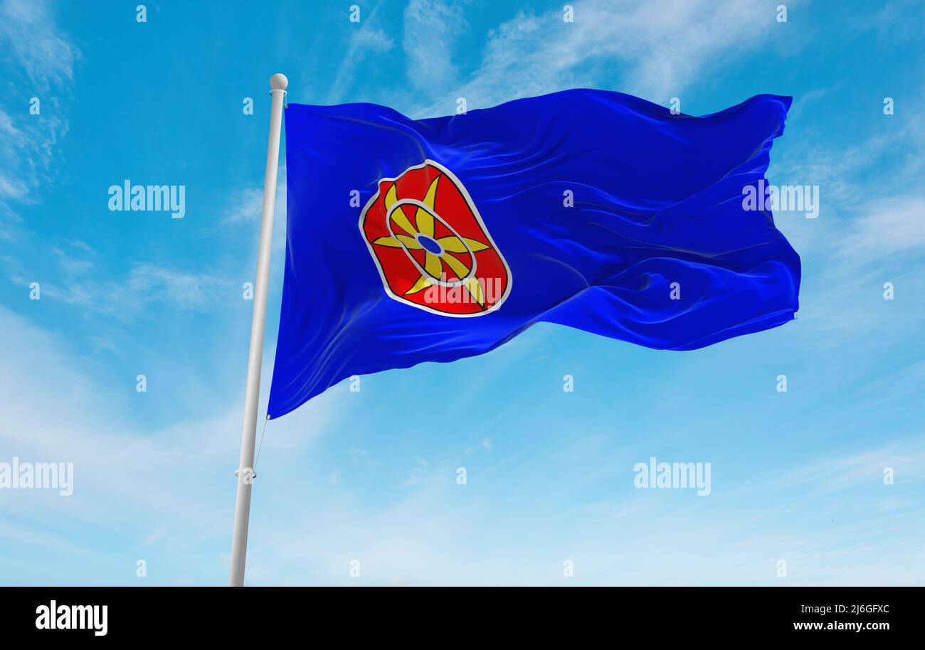 official flag of Kven people , Norway at cloudy sky background on ...