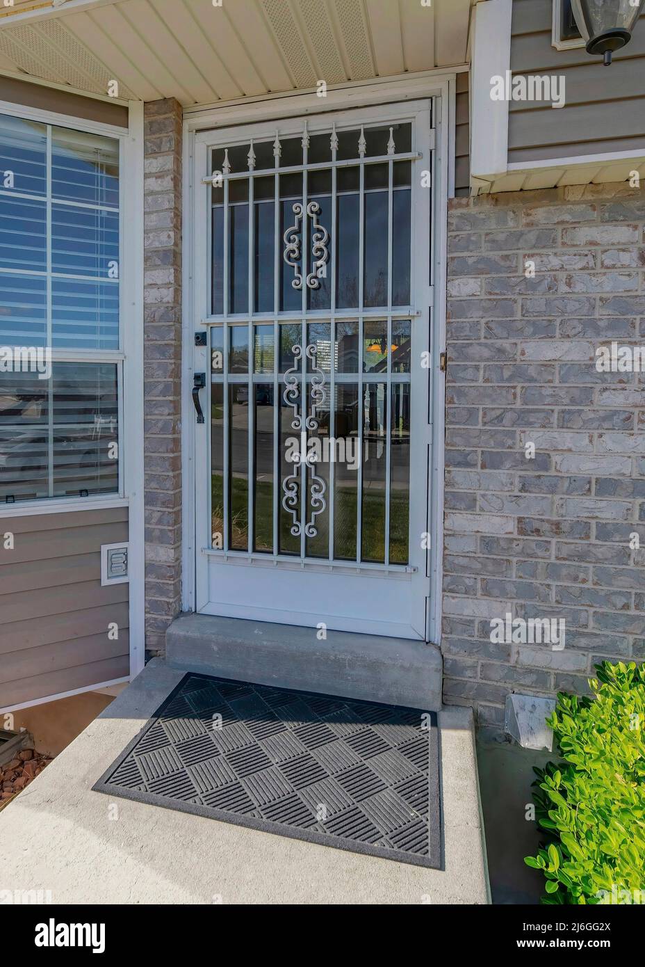Vertical Puffy clouds at sunset Entrance of a house with glass front ...