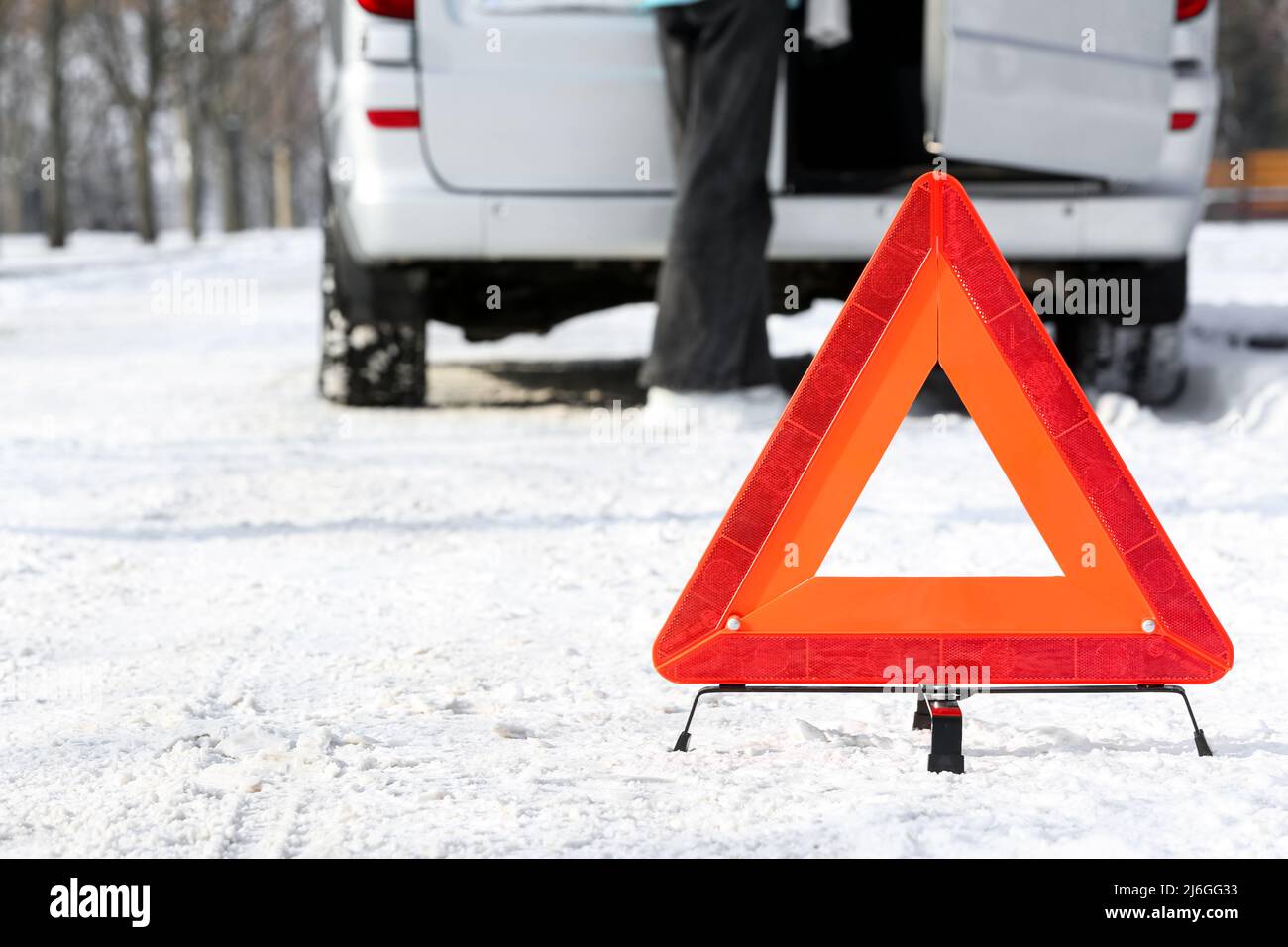 Emergency stop sign and broken car on cold winter day Stock Photo - Alamy