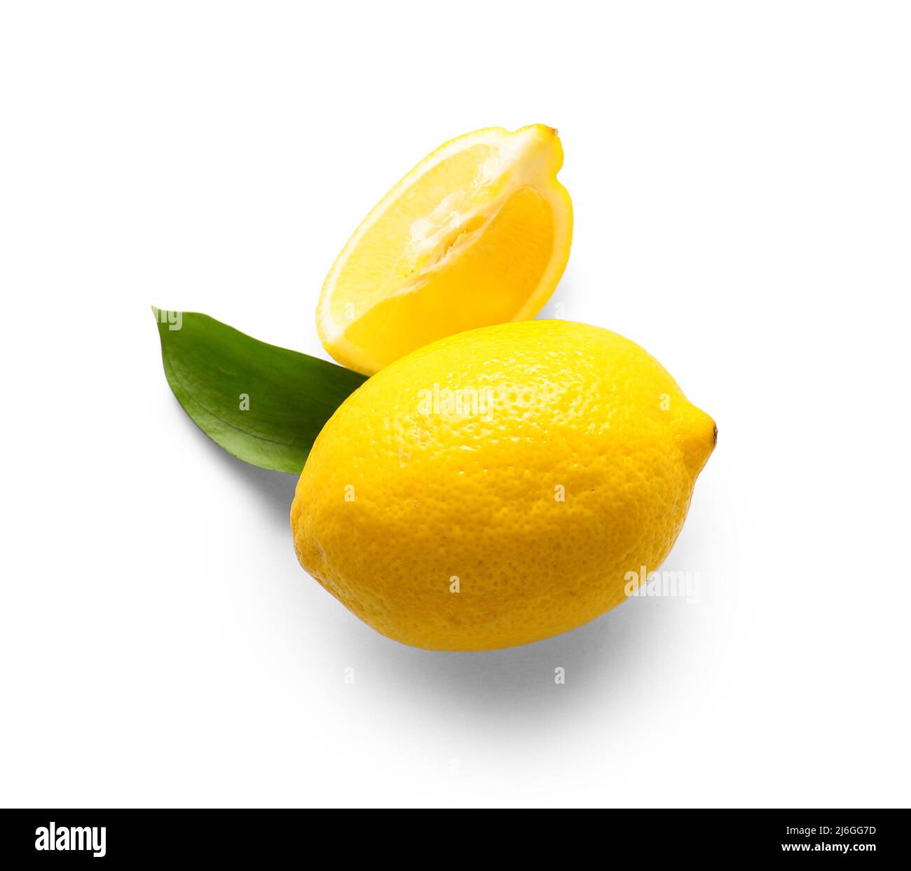 Lemons with leaf on white background Stock Photo - Alamy