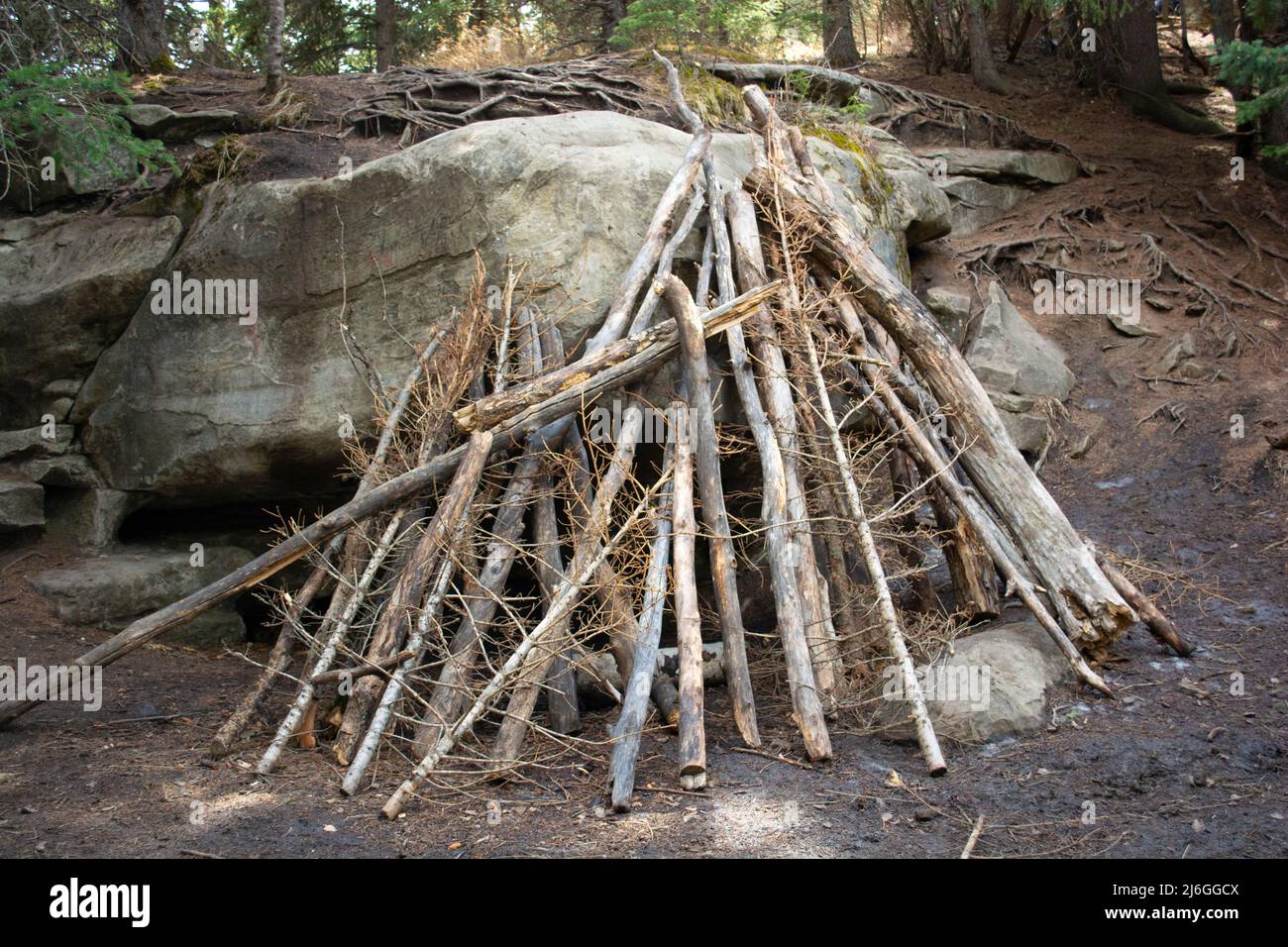 Lean-to Wood Shelter on Overhanging Rock Cave Stock Photo - Alamy