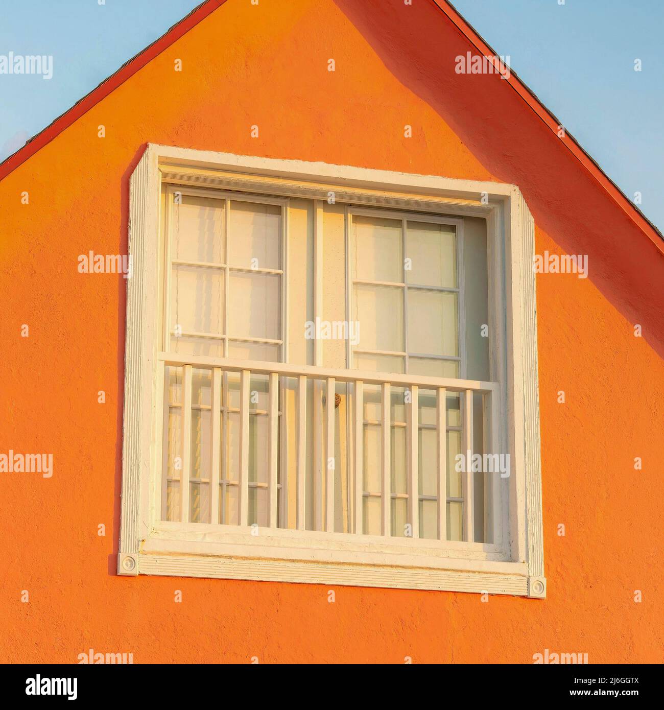 Square Puffy clouds at sunset Orange gable roof with attic at Oceanside ...