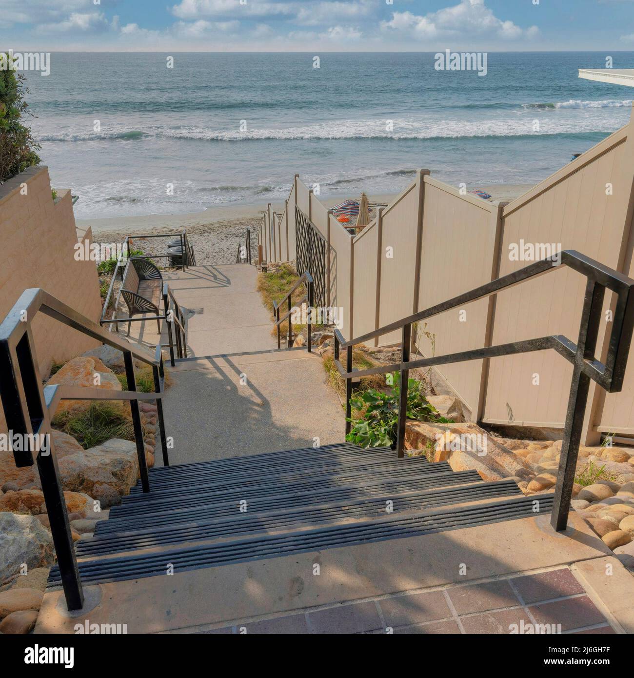 Square White puffy clouds Staircase in the middle of beach houses ...