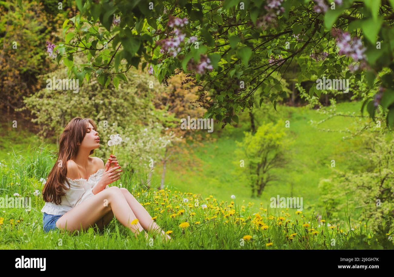 Spring happy woman sitting outdoor in park summer. Healthy breathing ...