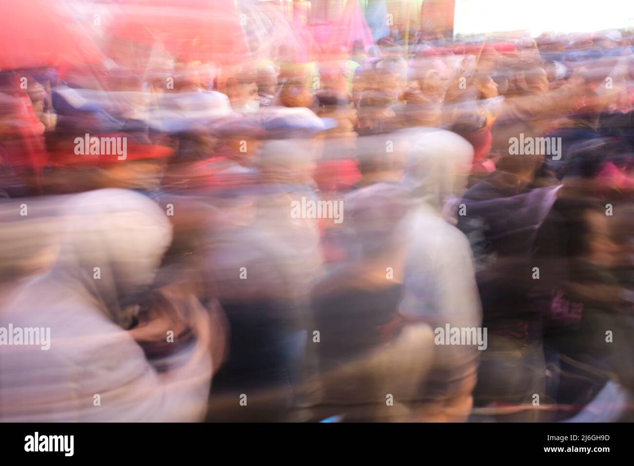 Long exposure photograph of a crowd, people marching during a ...