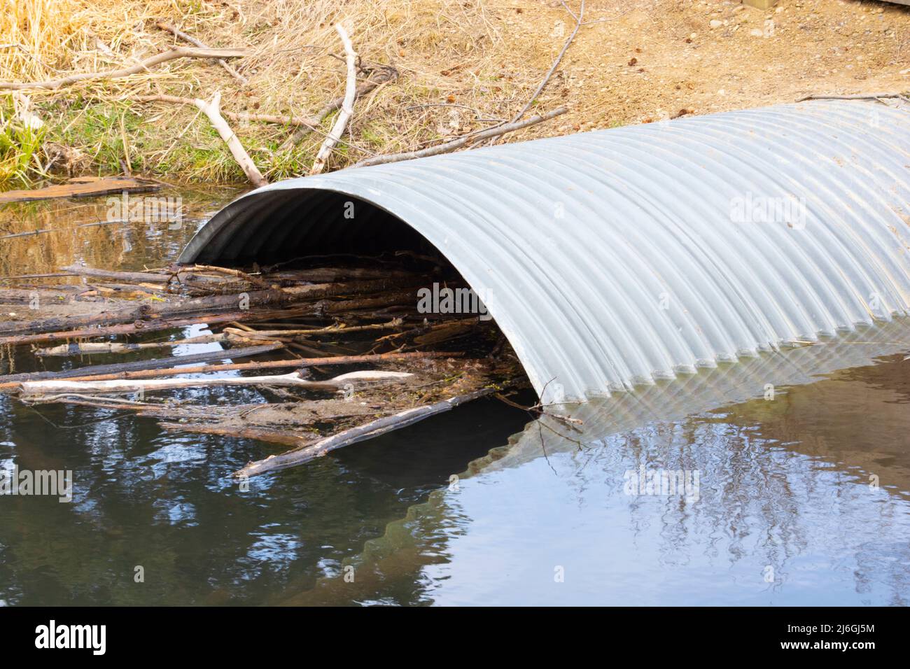 Culvert Pipe Under Road From Stream Oxbow in Park Stock Photo - Alamy