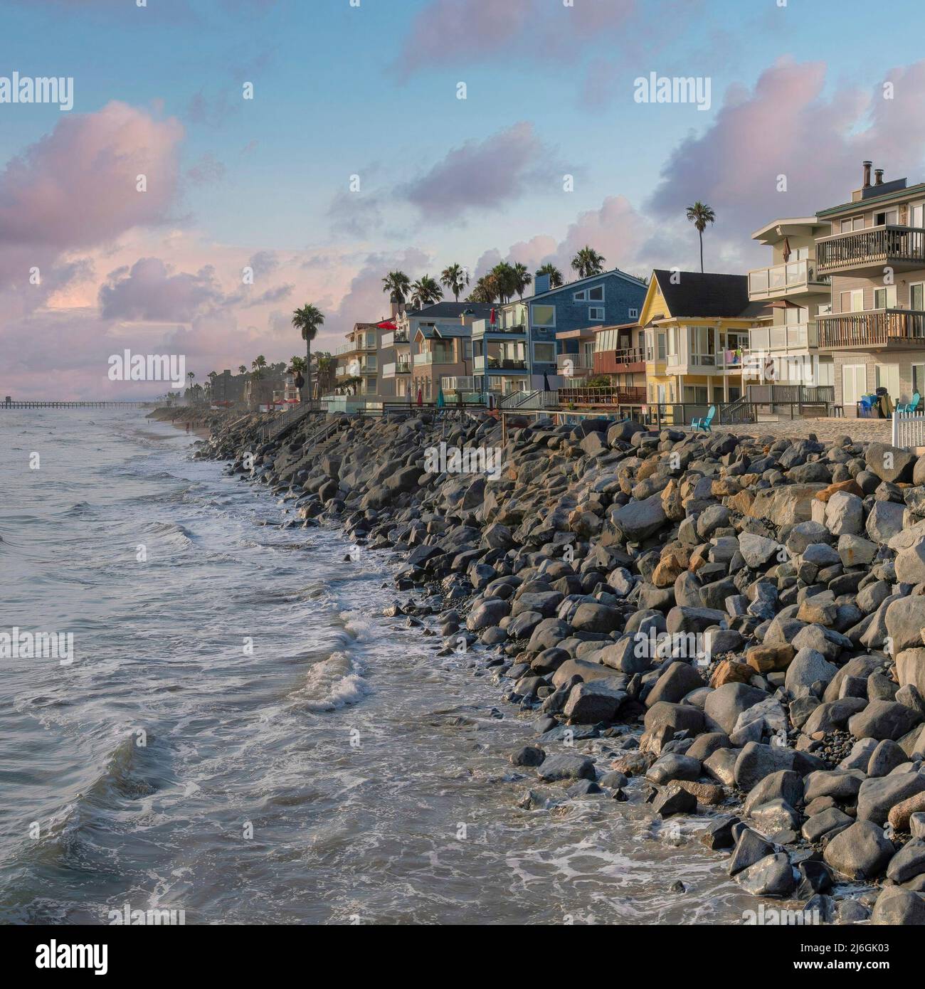 Square Puffy clouds at sunset Residential buildings at the coastal area ...