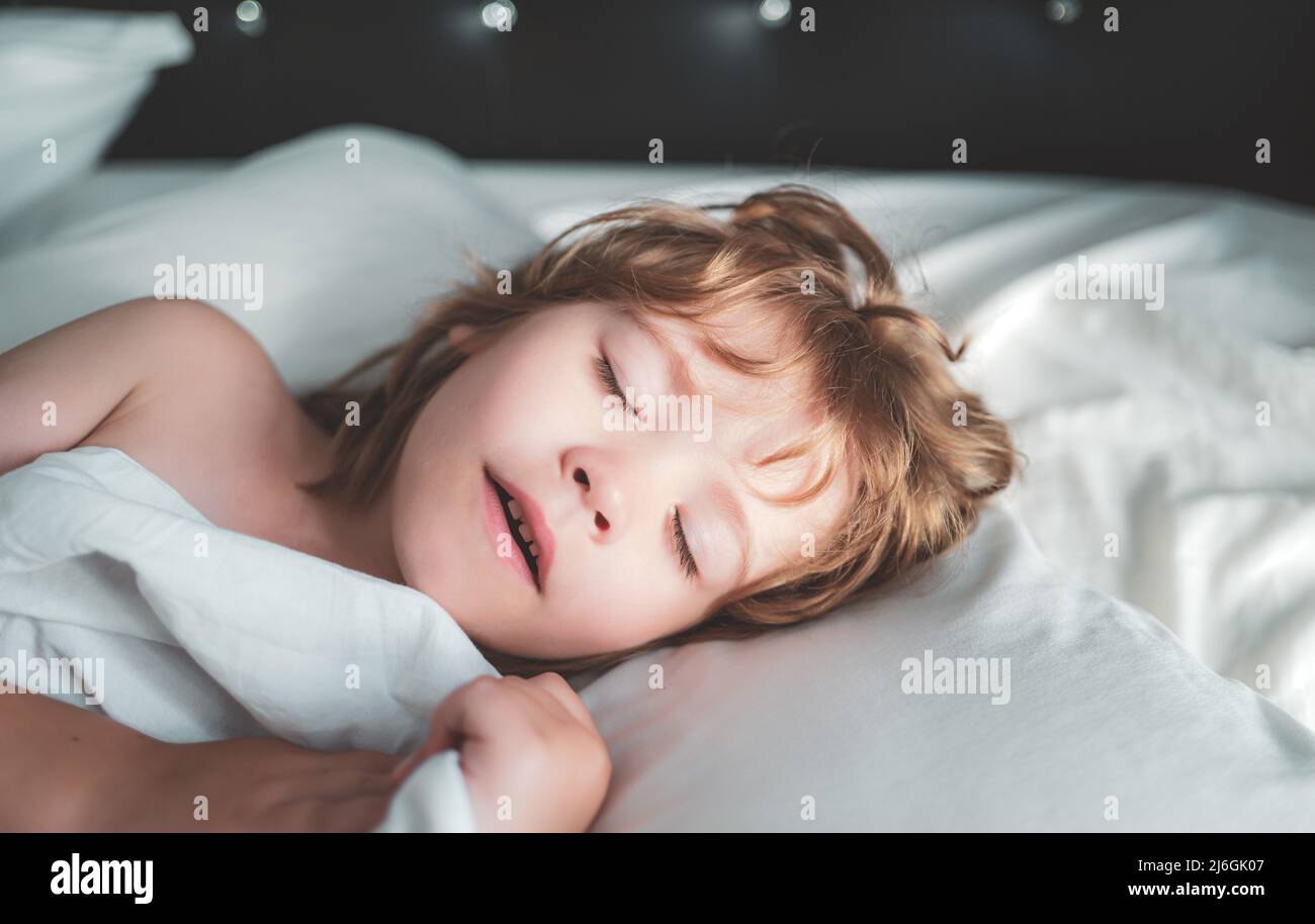 Sleeping kids in bed. Six years old Kid sleep in bed Stock Photo - Alamy