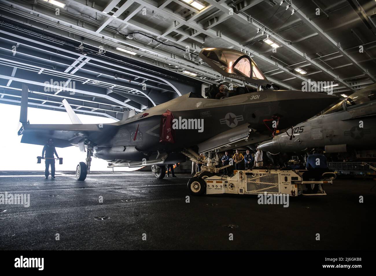 PHILIPPINE SEA (April 5, 2022) Sailors transport an F-35C Lightning II ...