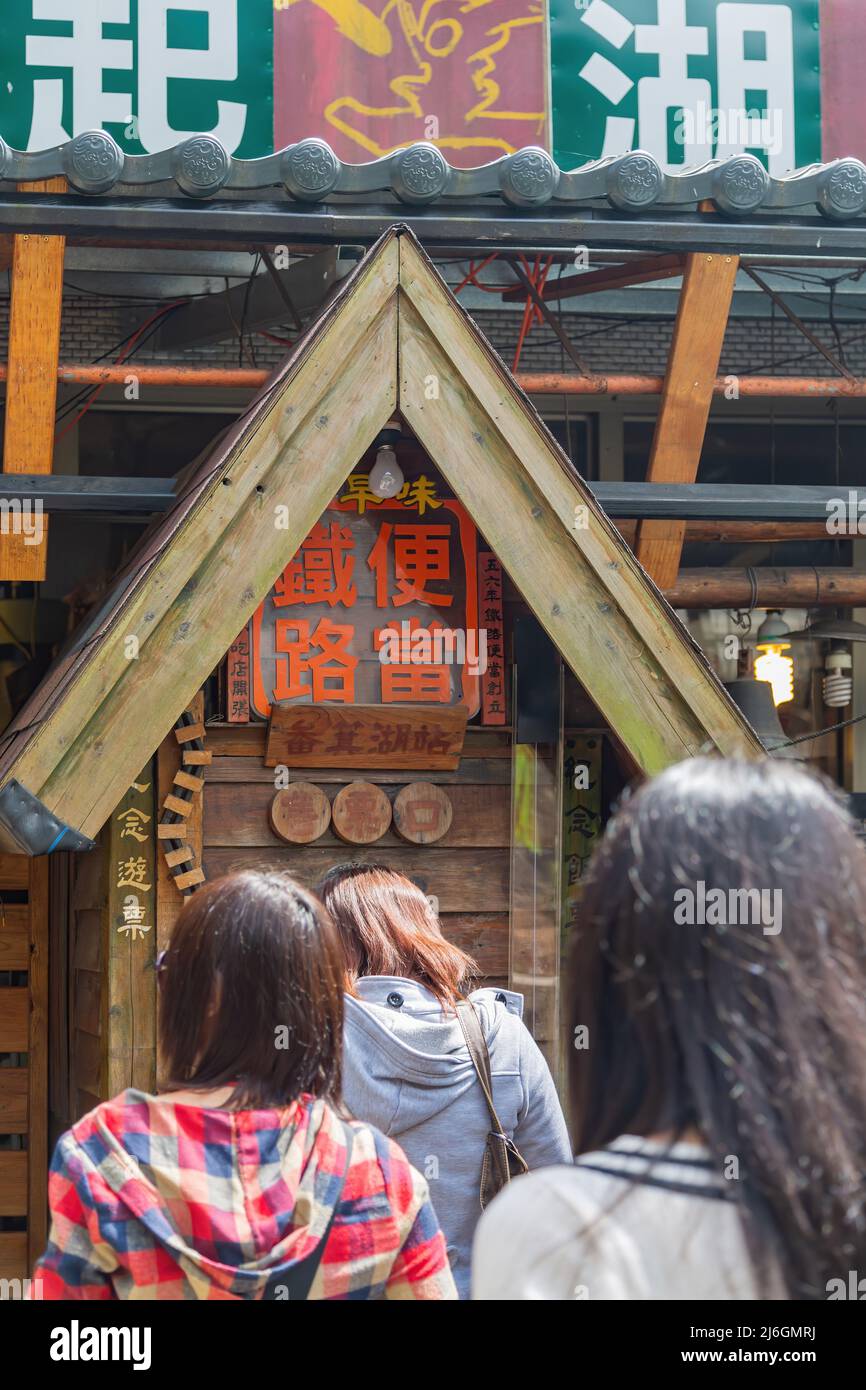 Chiayi, MAR 17, 2012 - Peopel waiting to buy the famous railway lunch ...
