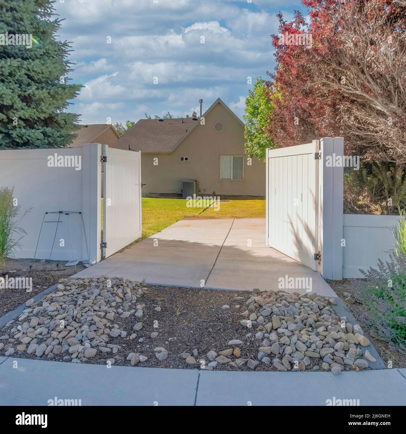Square White puffy clouds Open double door gate of a trailer parking at ...