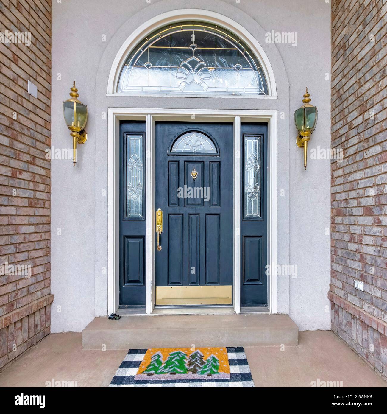 Square Stunning front door exterior of a house with golden fixtures ...