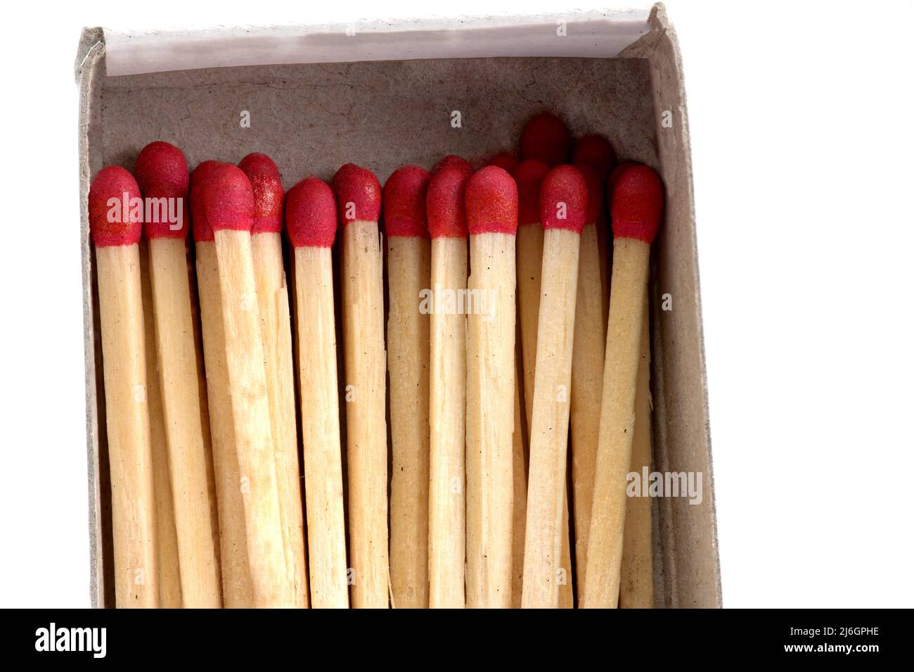 extreme close up of stacked matches with red match heads in open ...