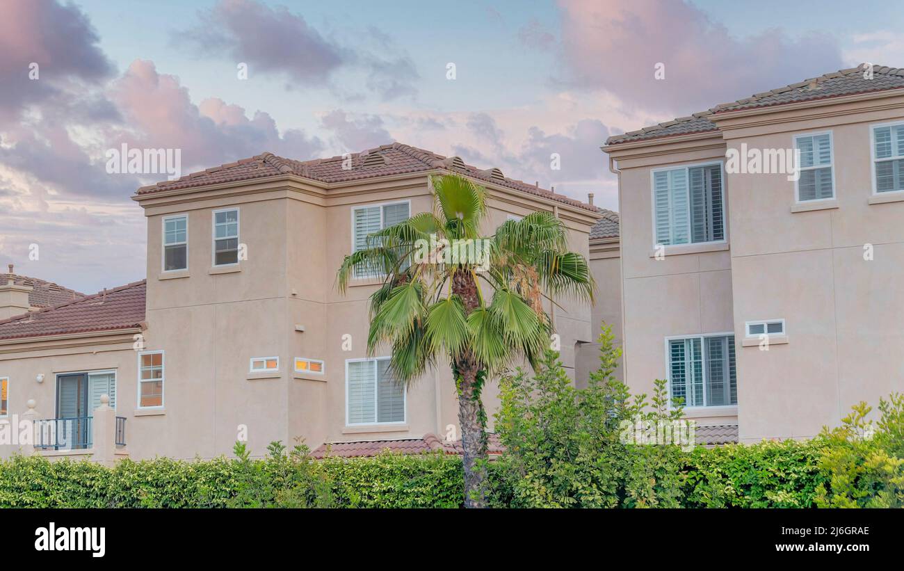Panorama Puffy clouds at sunset Large mediterranean style residences at ...