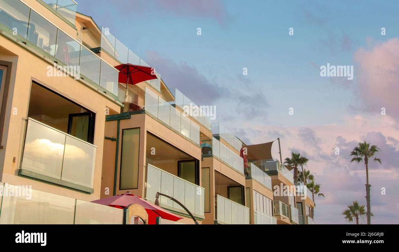 Panorama Puffy clouds at sunset Beach house hotel building in a low ...