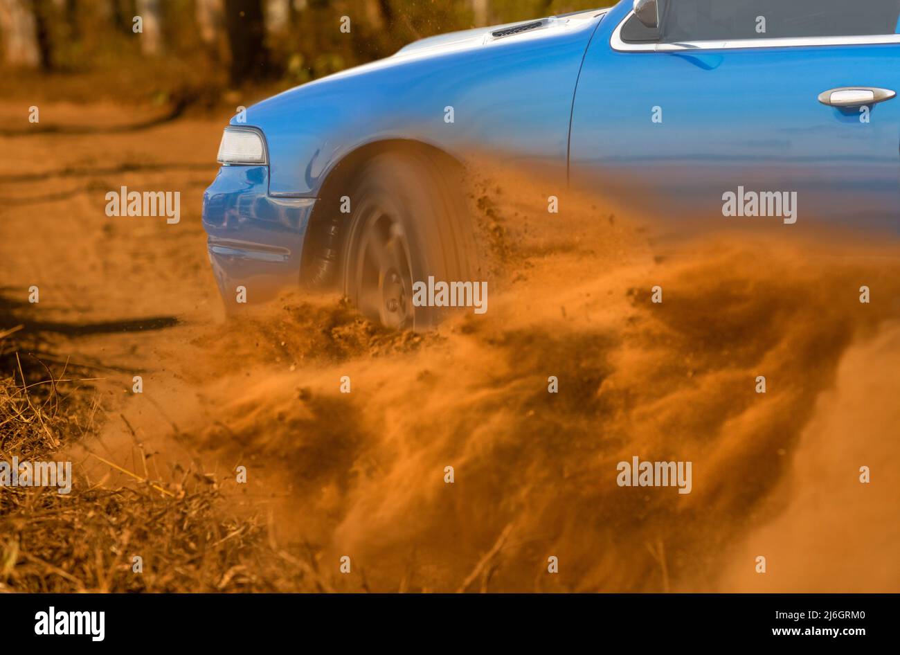 Rally race car drifting on dirt track Stock Photo - Alamy