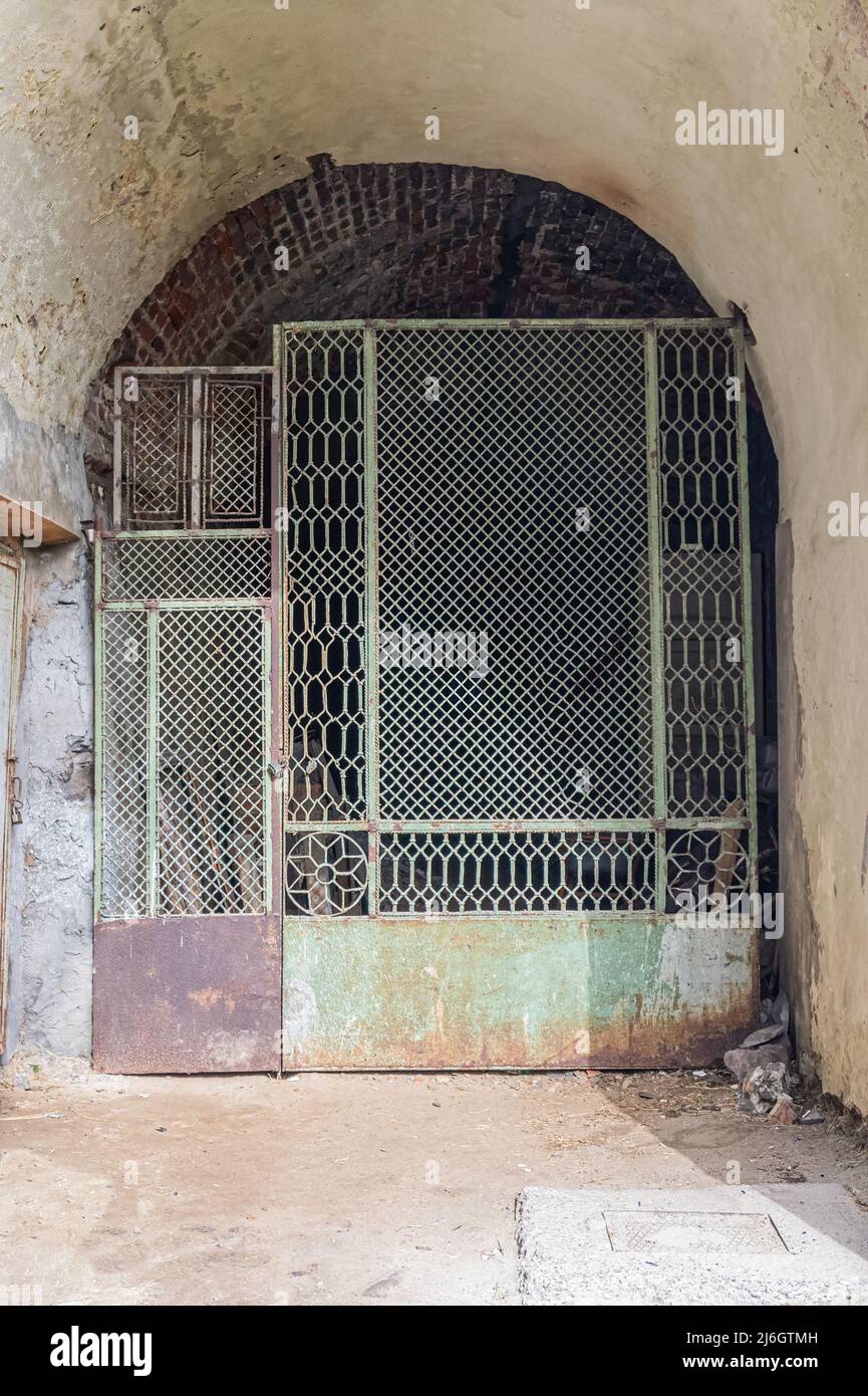 old metal gate with peeling paintin the arch. collected from different ...