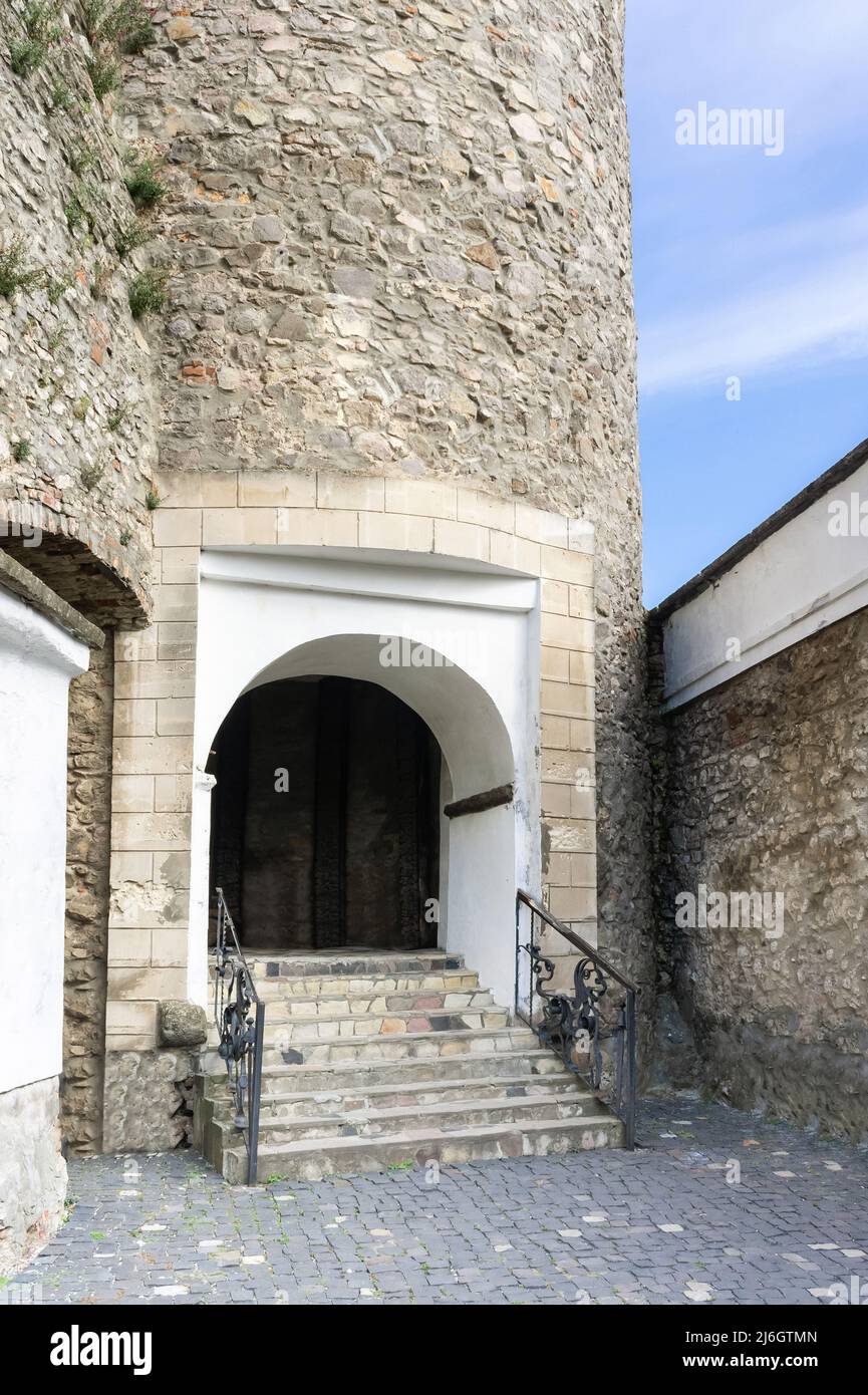 stone staircase in the castle with the entrance to the arch Stock Photo ...