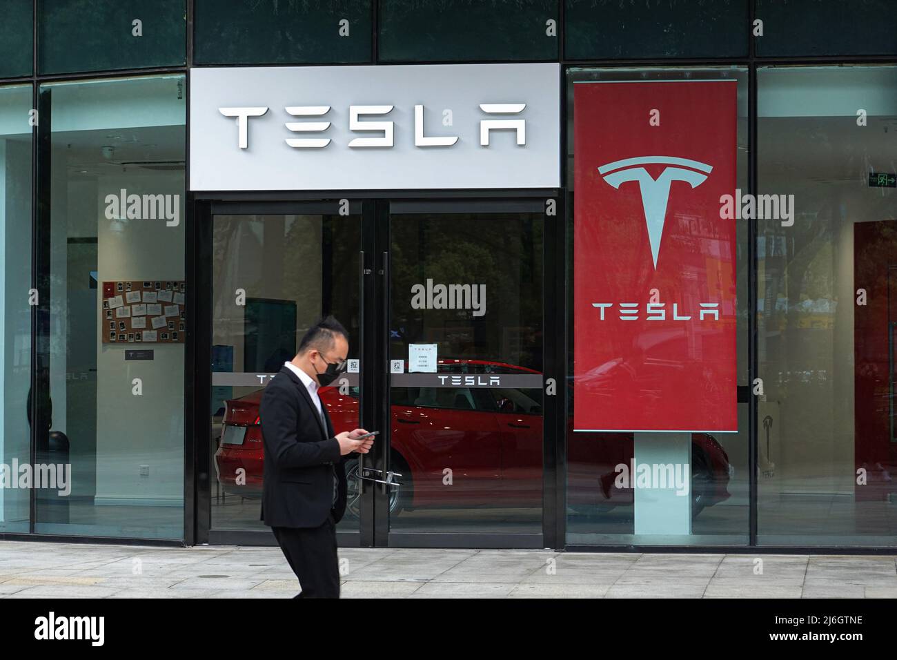 The Tesla logo is pasted on the floor-to-ceiling Windows. (Photo by ...