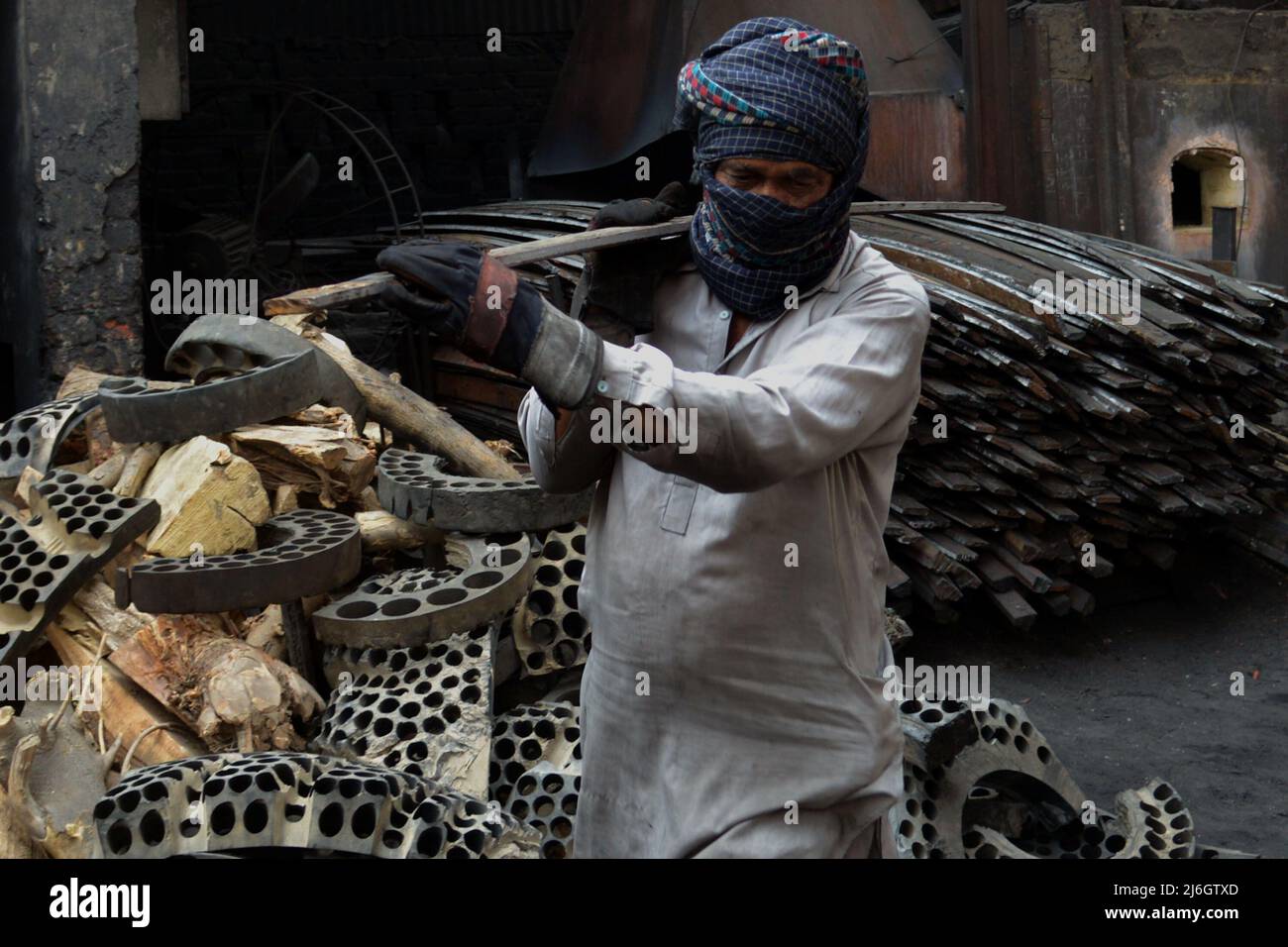 May 1, 2022, Lahore, Punjab, Pakistan: Pakistani laborers work at an ...