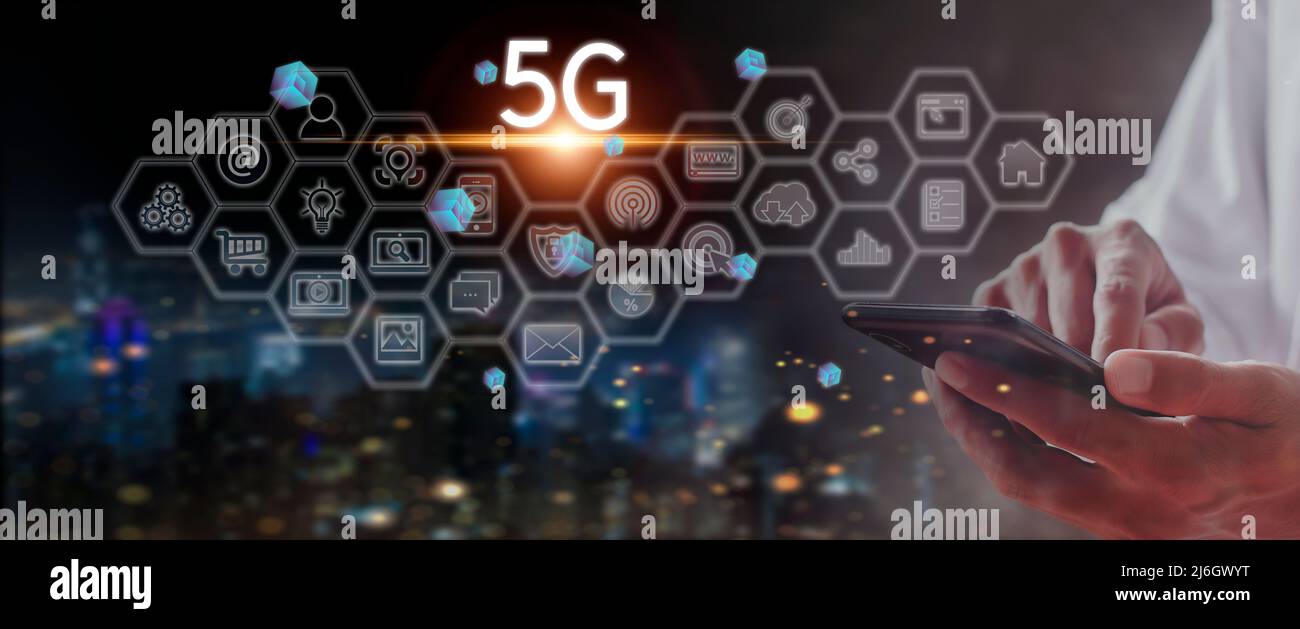 Hand of business man hold mobilephone connect network 5G with icon ...