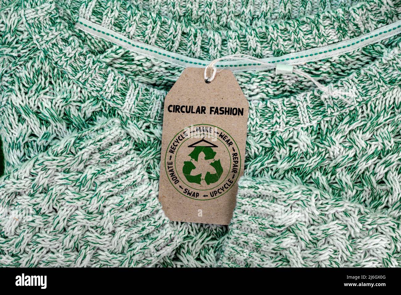 Circular Fashion label on jumper, , make, wear, repair, upcycle, swap ...