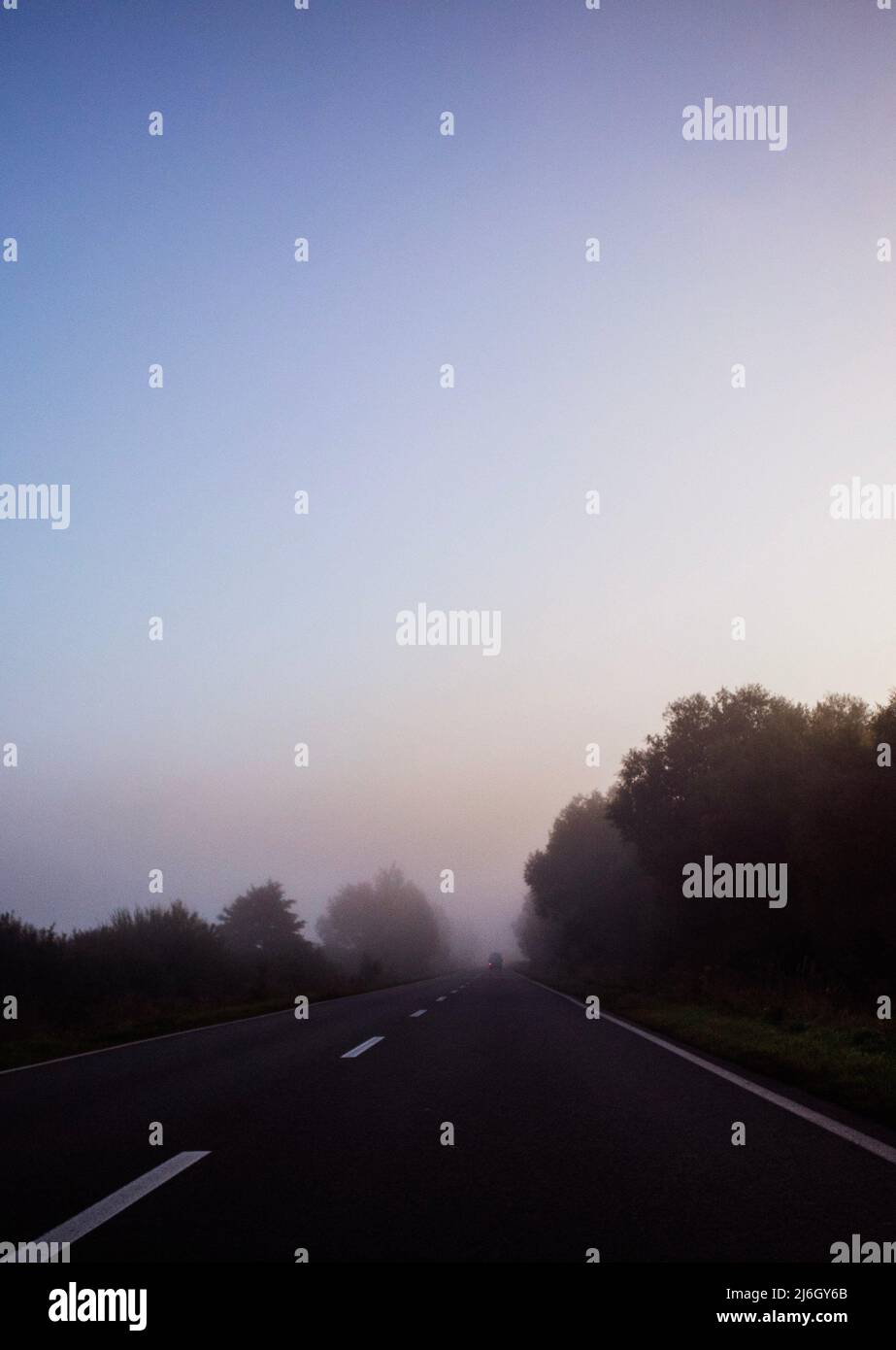 Morning foggy road way. Rural view Stock Photo - Alamy