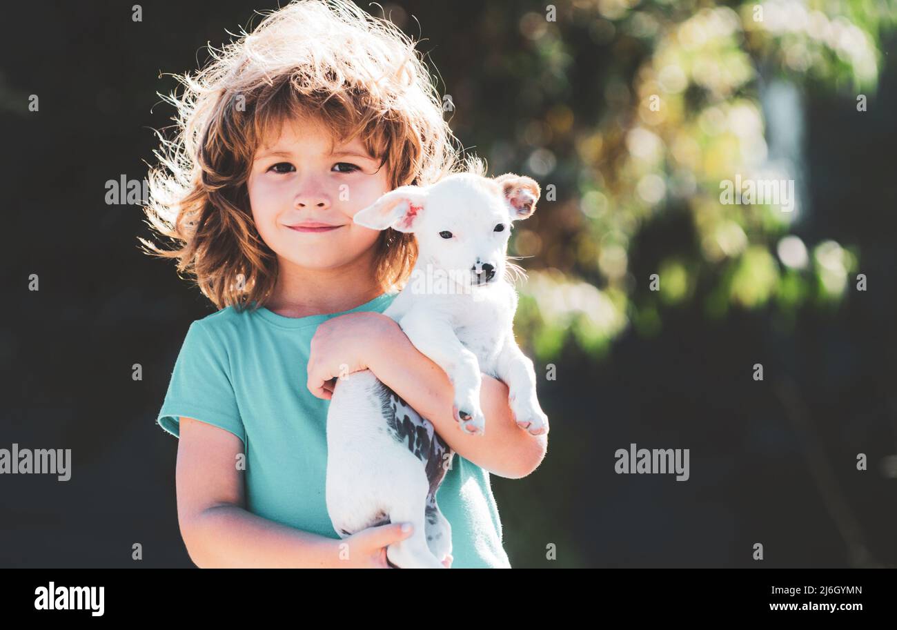 Cute kid hugging dog. Child and puppy playing outside Stock Photo - Alamy