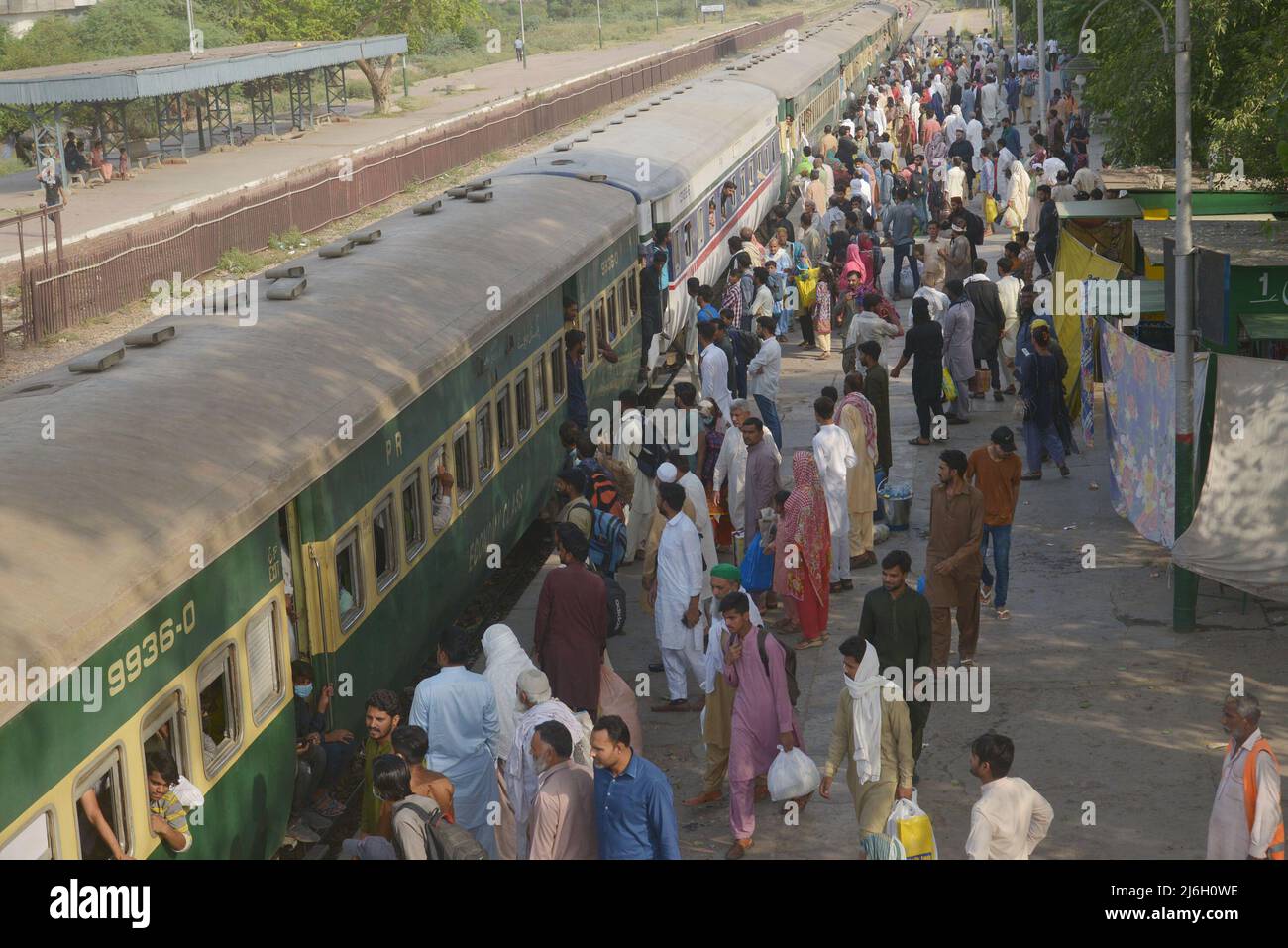April 30, 2022, Lahore, Punjab, Pakistan: Pakistani people ride on a ...