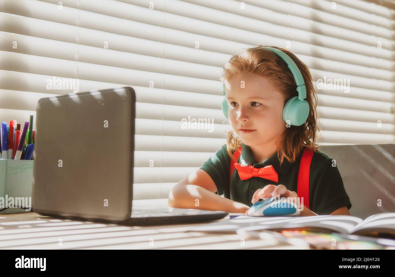 Online remote learning. School kids with computer having video ...