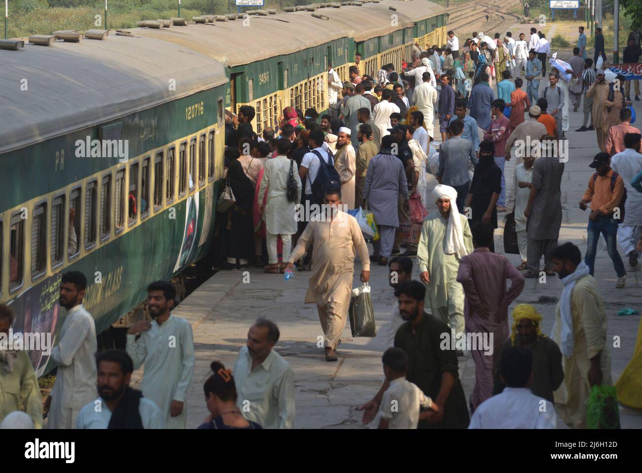 April 30, 2022, Lahore, Punjab, Pakistan: Pakistani people ride on a ...