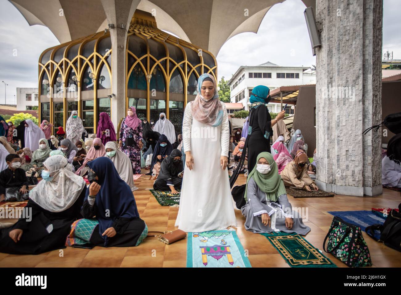 A muslim woman performs Eid al-Fitr prayers at the Foundation of the ...