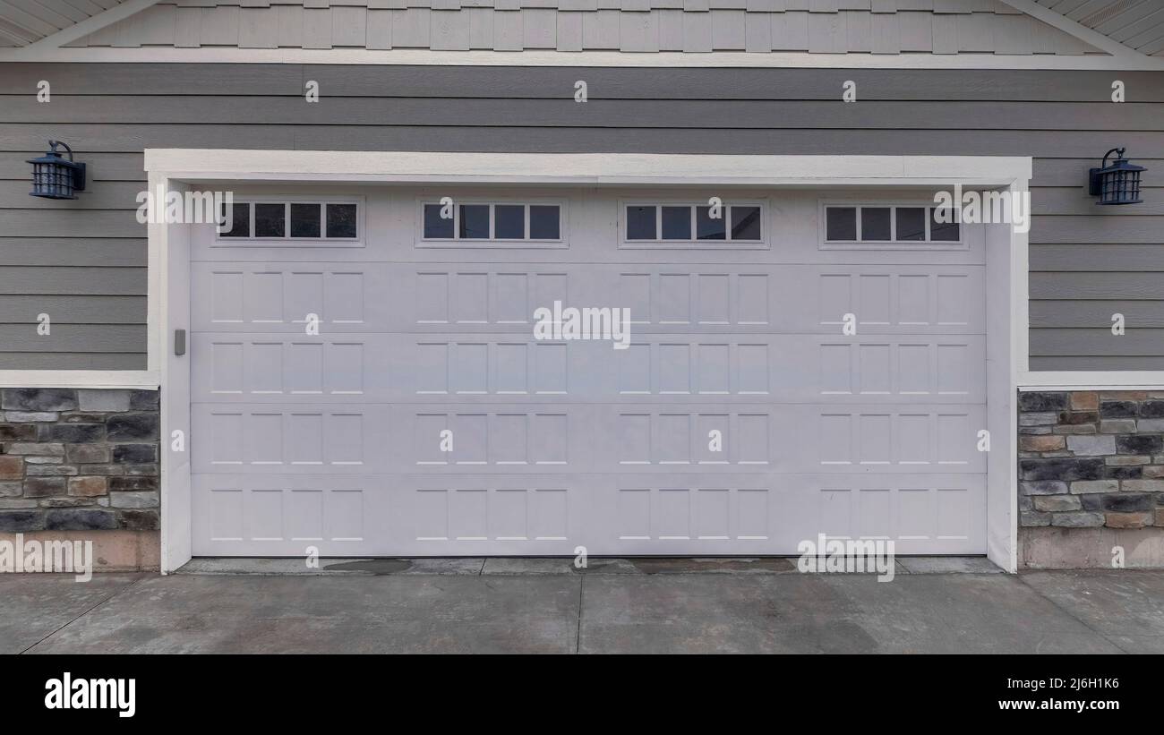 Panorama Whispy white clouds Traditional garage exterior with white and ...