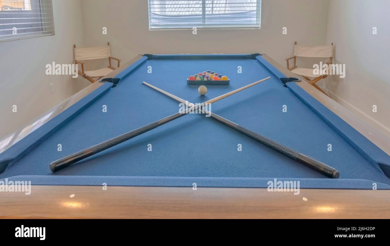 Panorama Blue billiard pool table with crossed pool cues and billiard ...