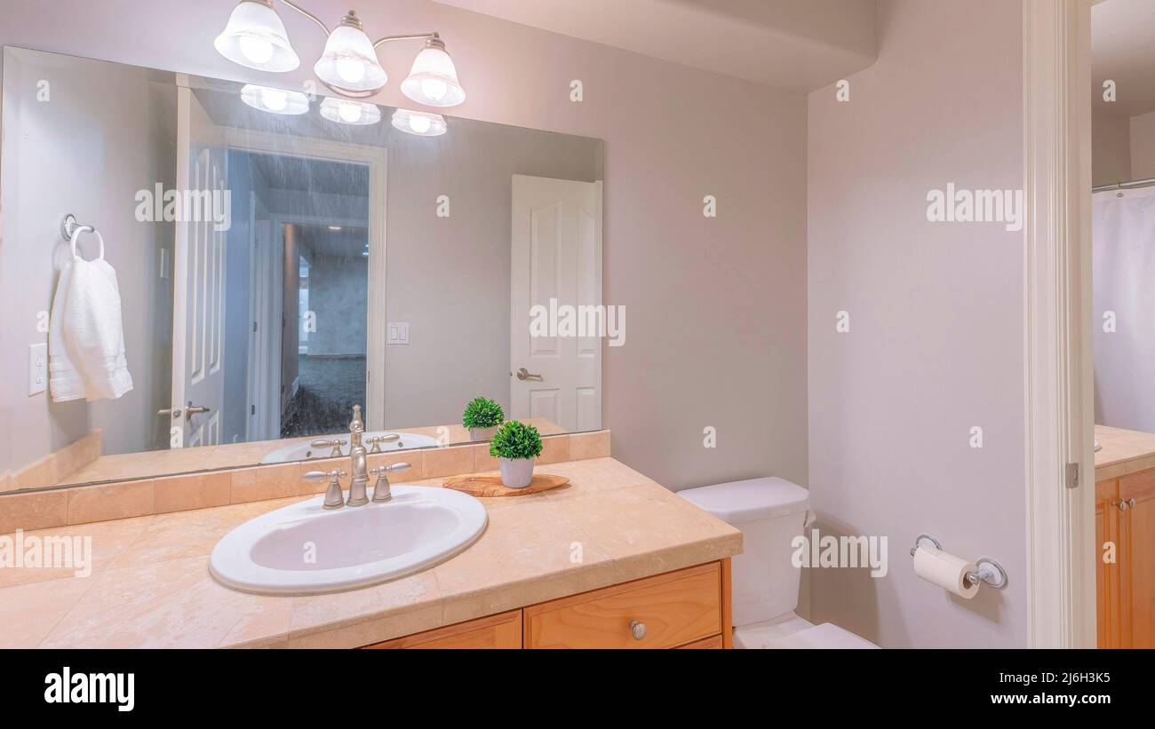 Panorama Interior of a bathroom with room inside and two vanities Stock ...