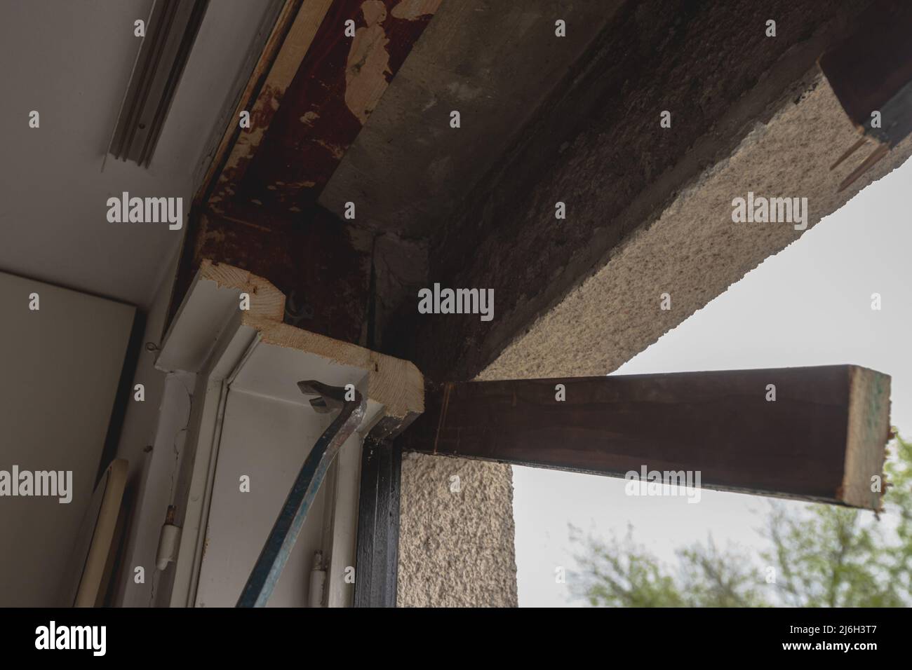 Old wooden windows being cut out from an old house, making way to ...