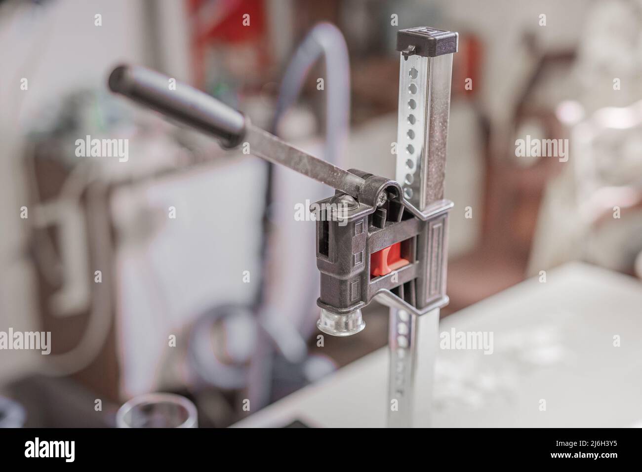 Tool for manual closing the bottle with a cap. Capping the bottle of ...