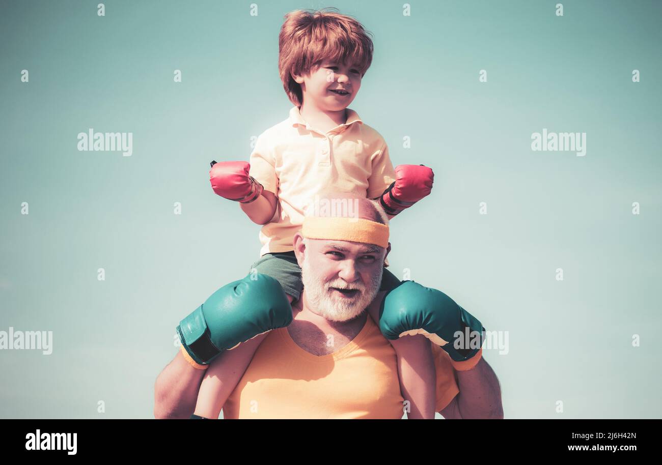 Healthy fighter Grandfather and grandson with boxing gloves ...