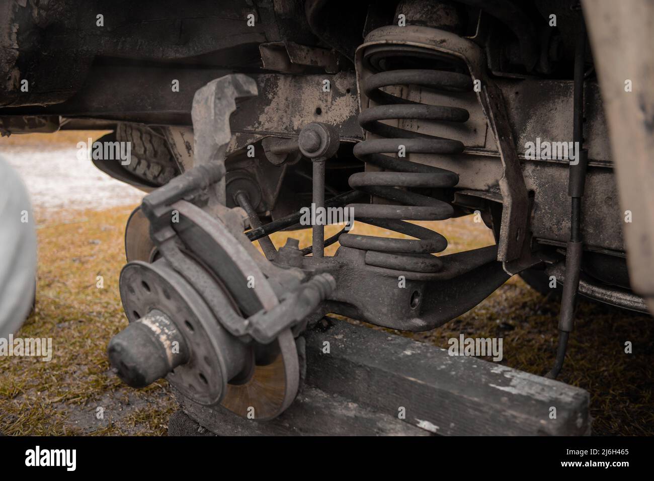 Dismantled parts of a front suspension assembly of a vintage truck ...