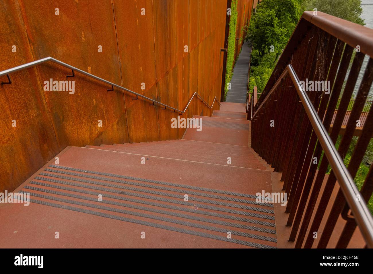 Stairs and handrail made out of rusty steel panels. Modern look of rust ...