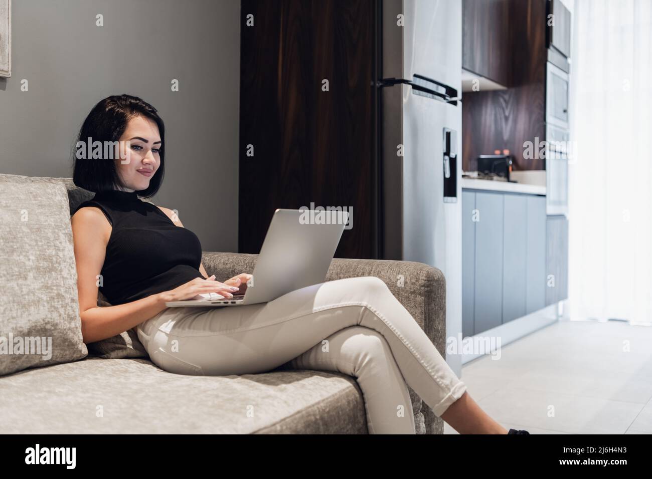 young beautiful woman using a laptop computer at home Stock Photo - Alamy