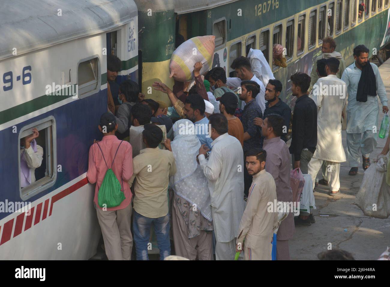 April 30, 2022, Lahore, Punjab, Pakistan: Pakistani people ride on a ...