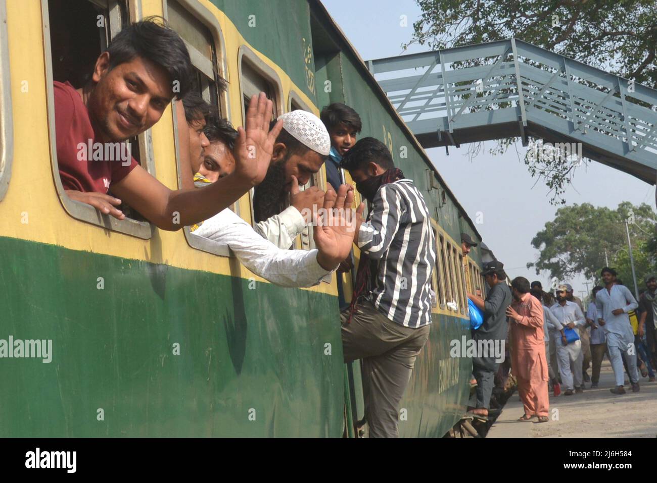 April 30, 2022, Lahore, Punjab, Pakistan: Pakistani people ride on a ...