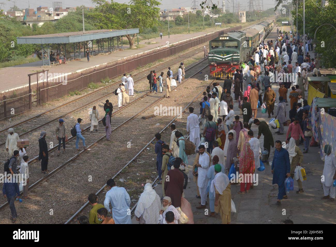 April 30, 2022, Lahore, Punjab, Pakistan: Pakistani people ride on a ...