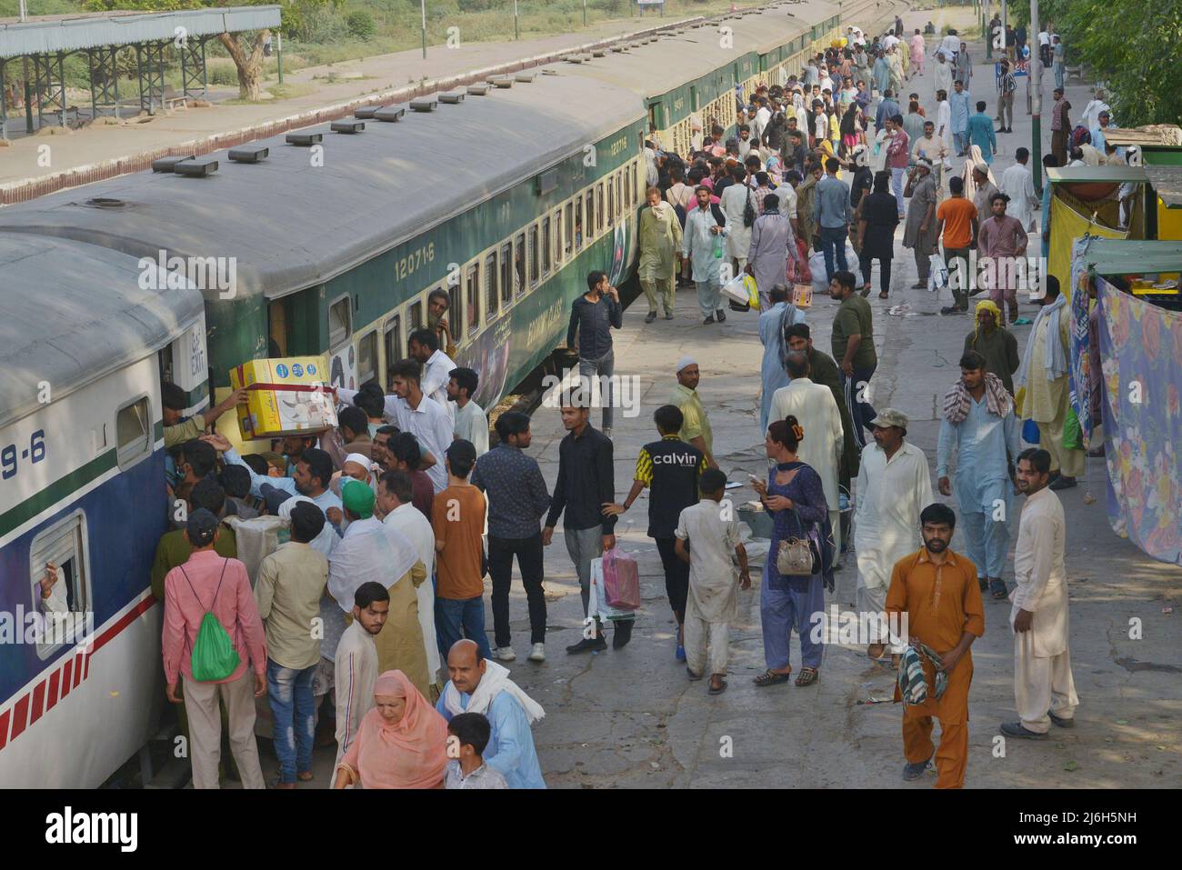 April 30, 2022, Lahore, Punjab, Pakistan: Pakistani people ride on a ...
