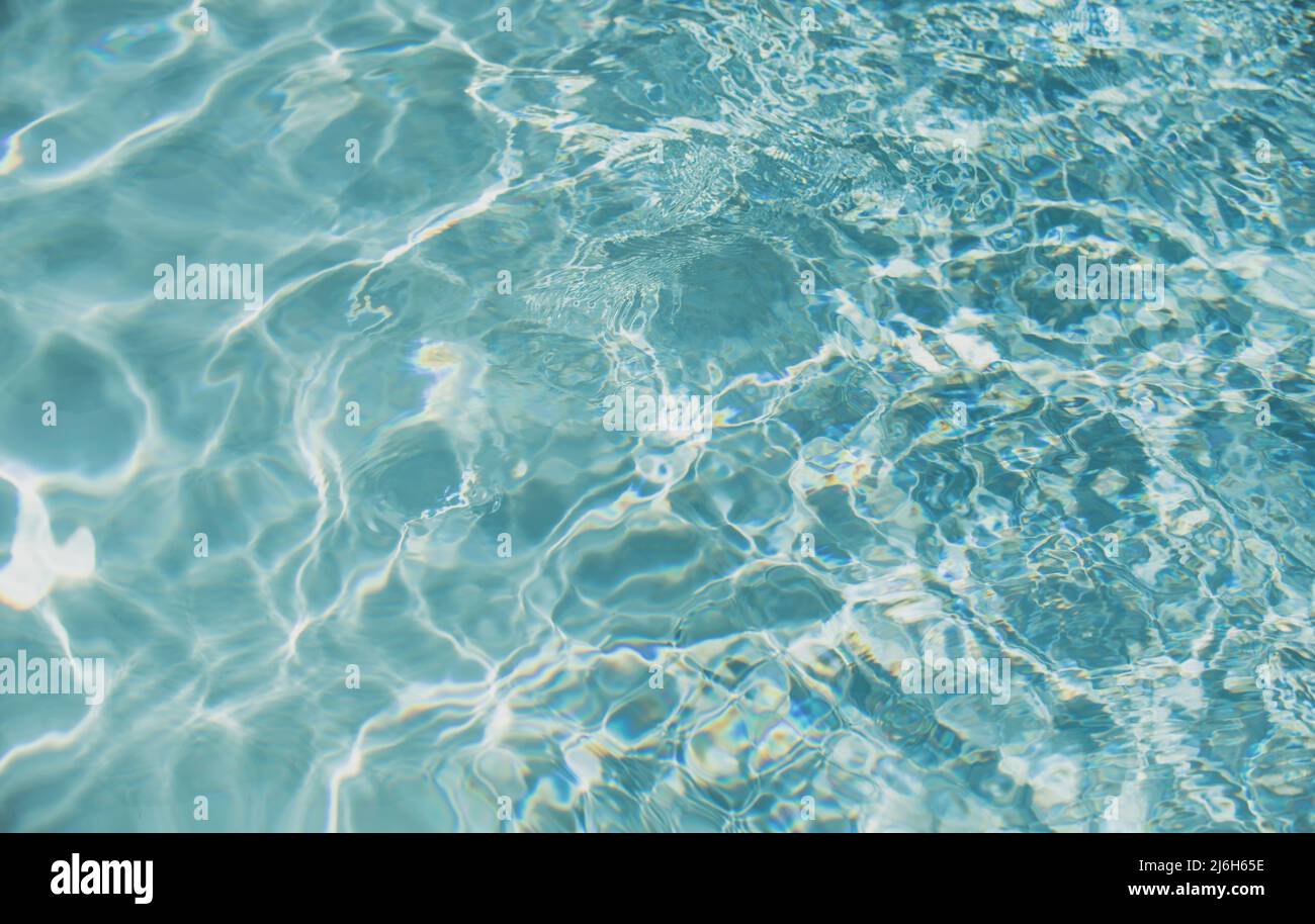 Water background. Blue water, ripples and highlights. Texture of water ...