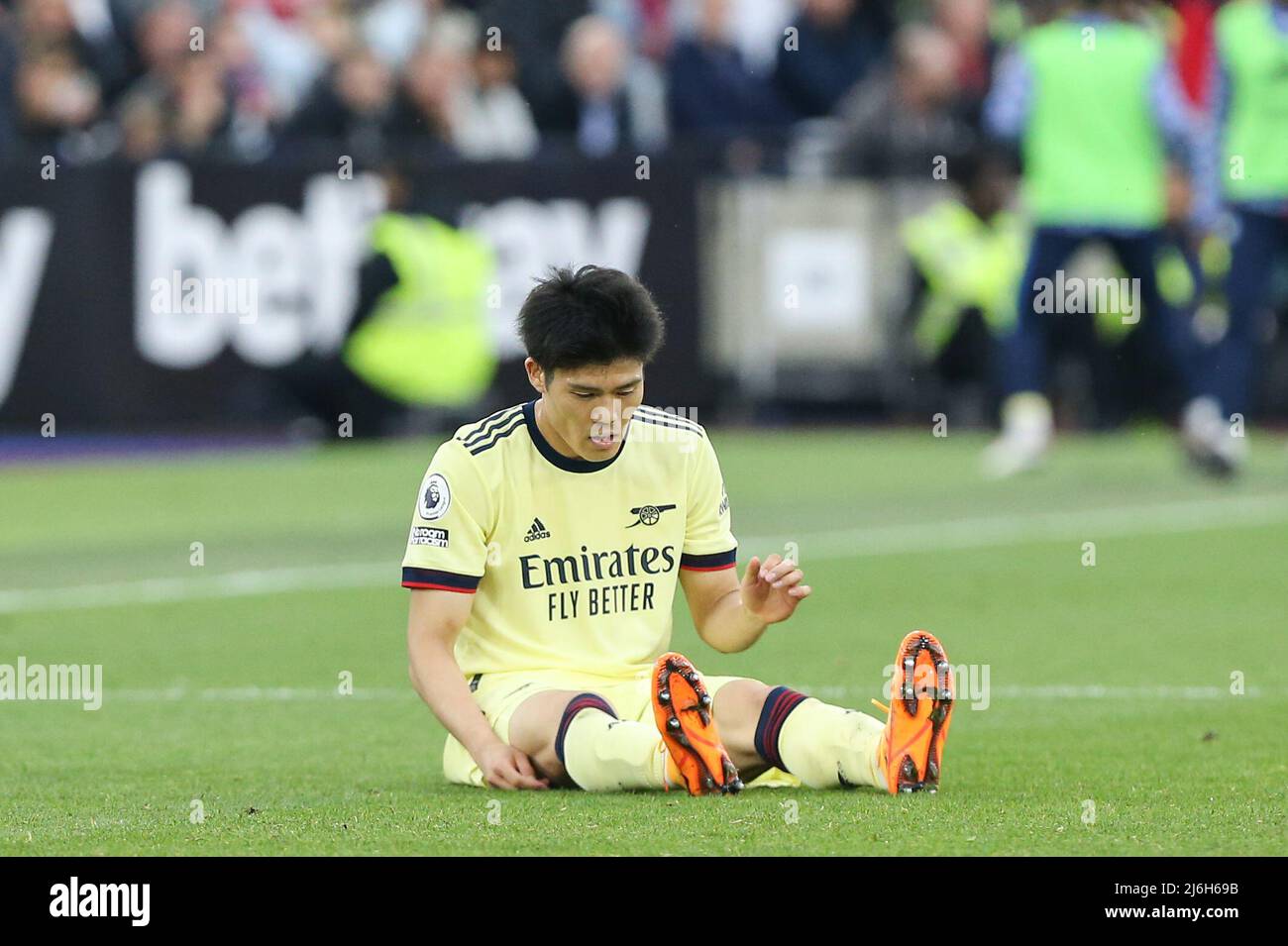 Takehiro Tomiyasu #18 of Arsenal picks up an injury Stock Photo - Alamy