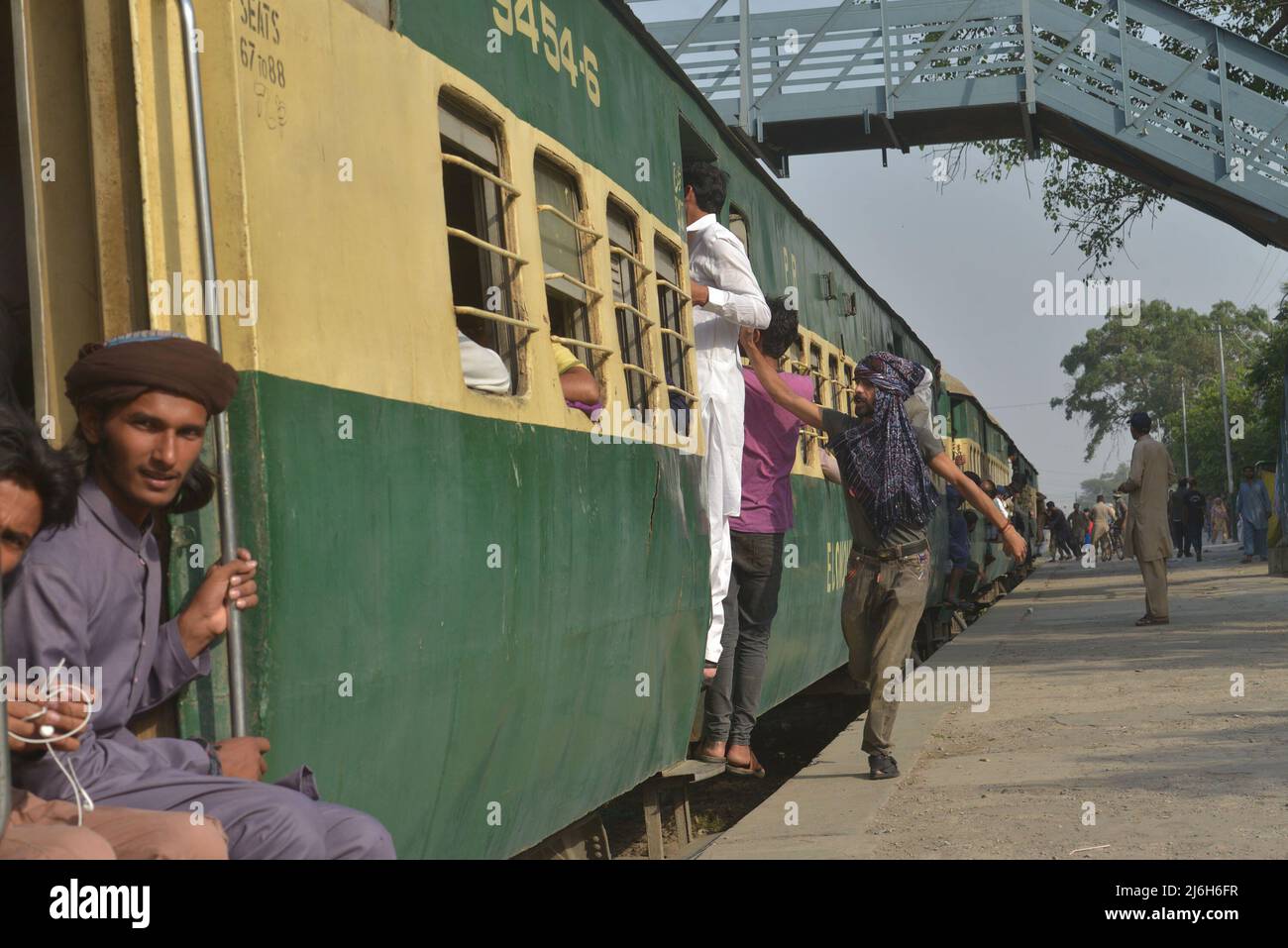 April 30, 2022, Lahore, Punjab, Pakistan: Pakistani people ride on a ...